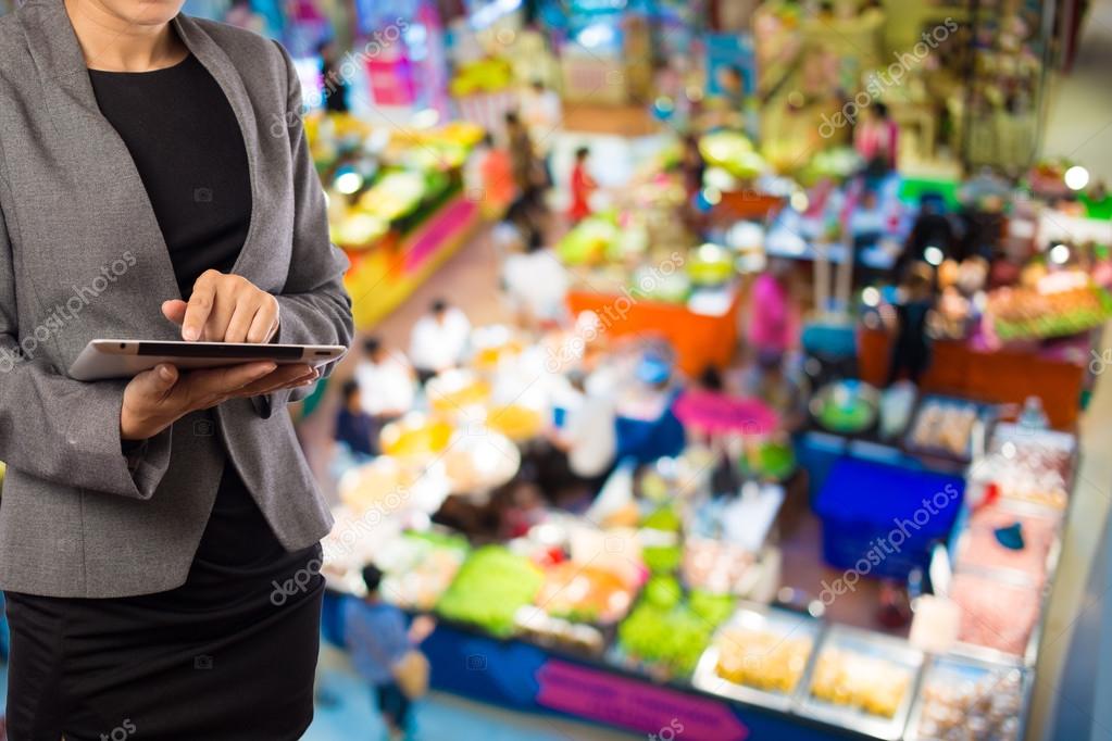 Women in shopping mall using mobile Tablet PC. Stock Photo by ©pat194 ...