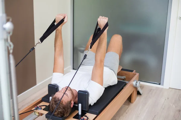 Pilates reformer man Stock Photos, Royalty Free Pilates reformer man ...