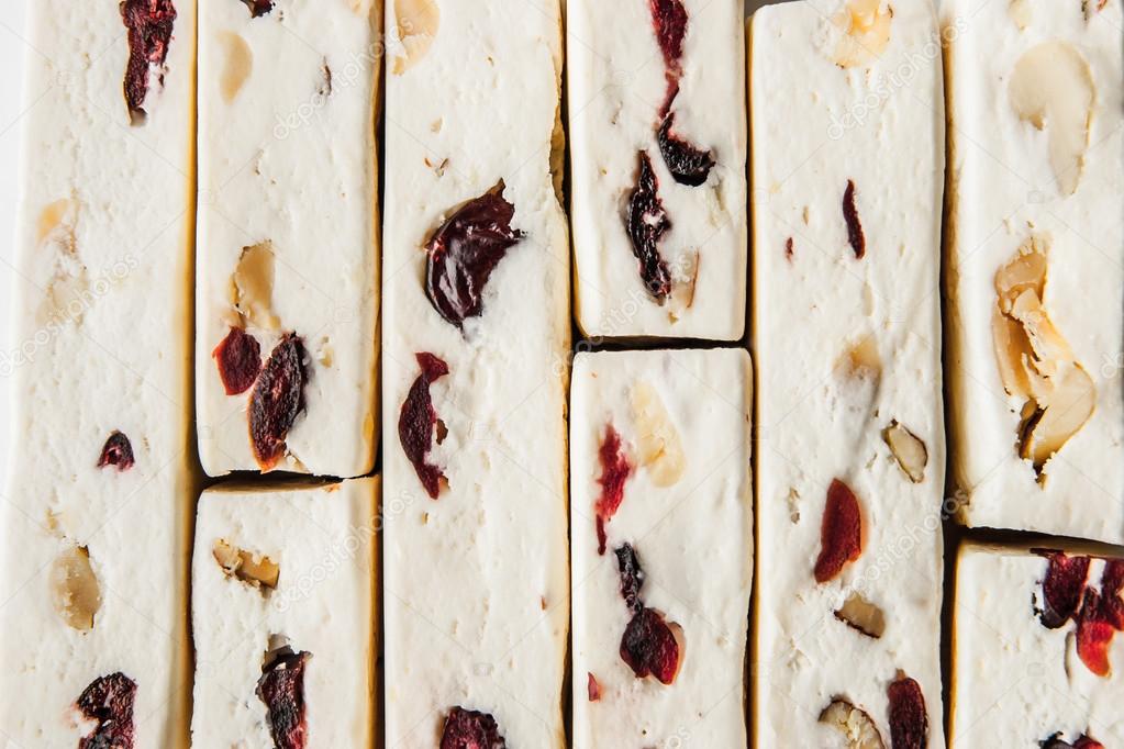 Nougat with fruit and nuts background horizontal — Stock Photo ...