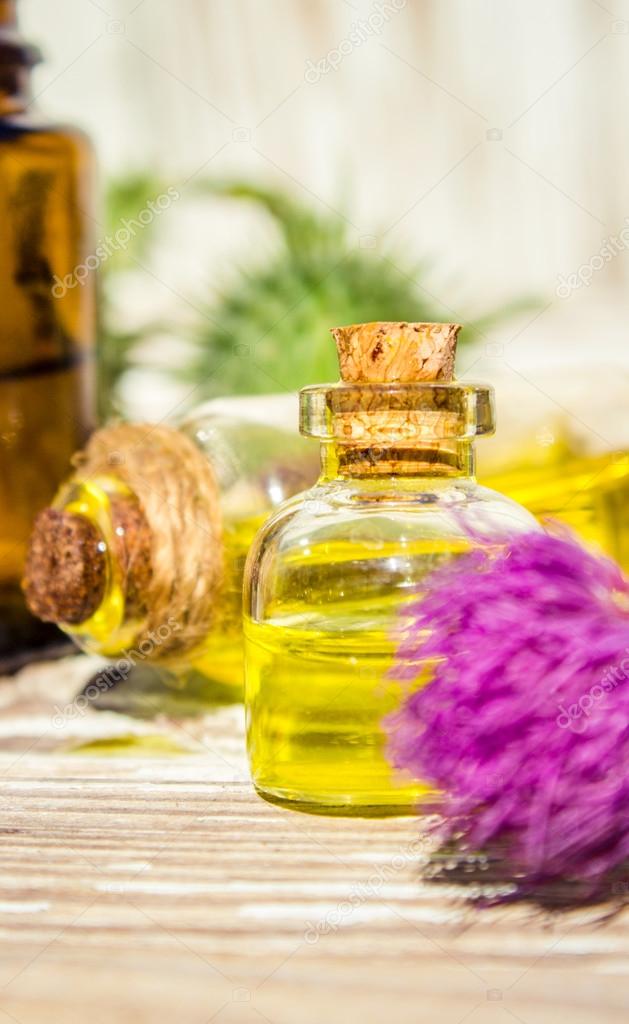 Burdock oil in a small bottle. extract, tincture, decoction, suspension ...