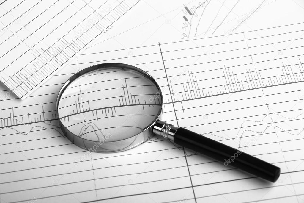 Magnifying glass with financial graph — Stock Photo © ChristianChan ...