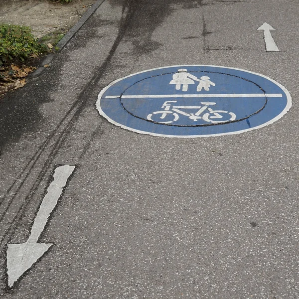 Road sign foot and bike path on the asphalt. Both pedestrians and ...