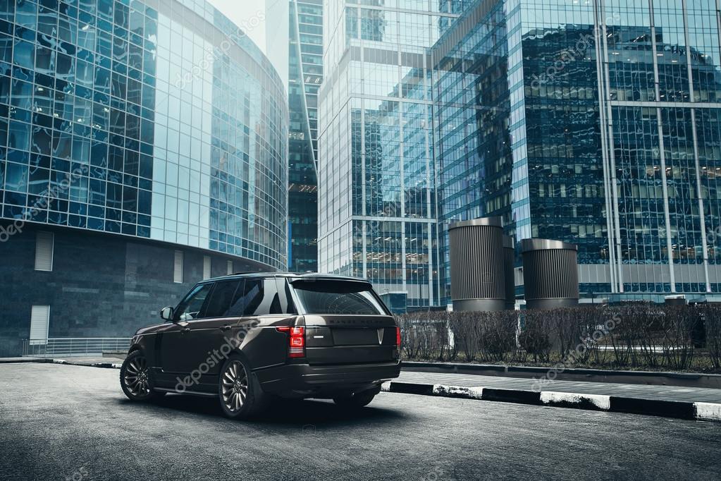 Premium car Land Rover Range Rover standing near modern building in the ...