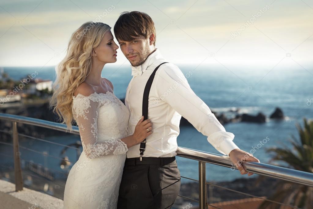 Romantic portrait of a marriage couple on the honeymoon Stock Photo by ...