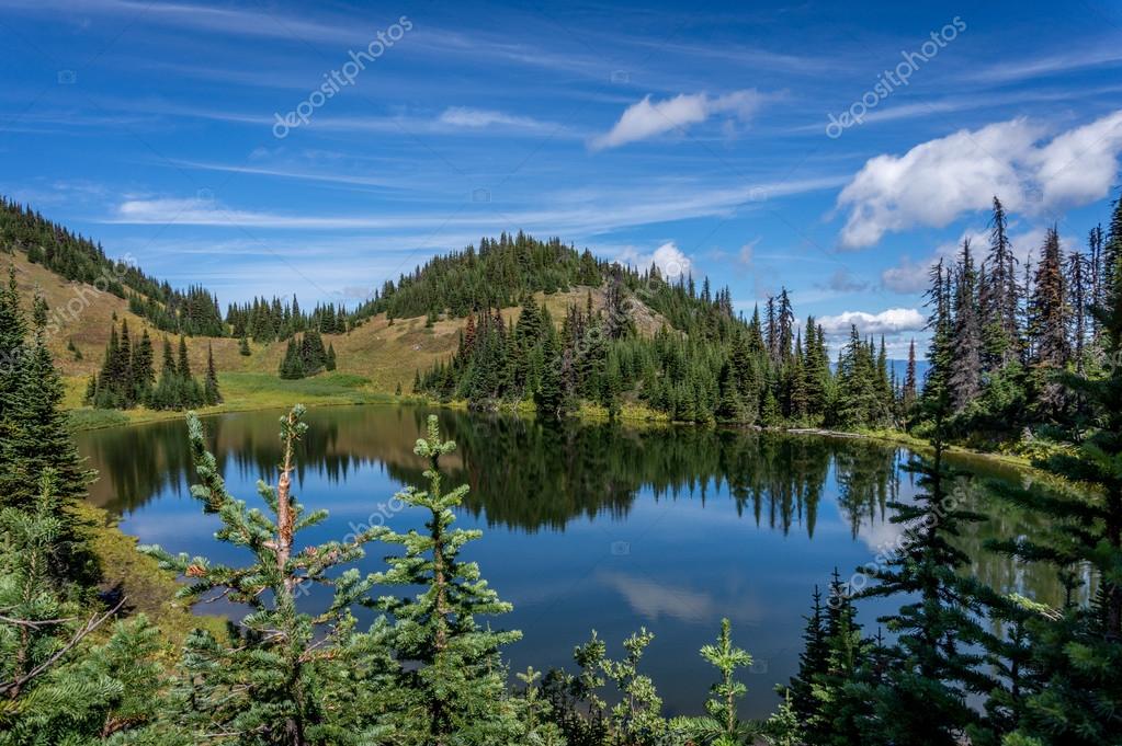 Tod Lake under a beautiful sky on a hike to the summit of Tod Mountain ...