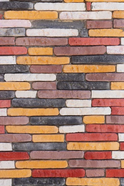Horizontal photography of colorful brick wall. Black, red, white and ...