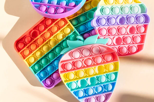 Rainbow Pop It Bubble Sensory Fidget Toy Stock Photo by ©MAnuta 477568832