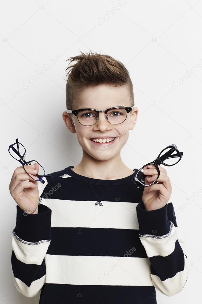 Boy holding pairs of glasses — Stock Photo © sanneberg #103923808
