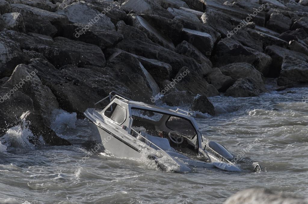 Sinking boat in front of the port — Stock Photo © sephirot17 #105345836