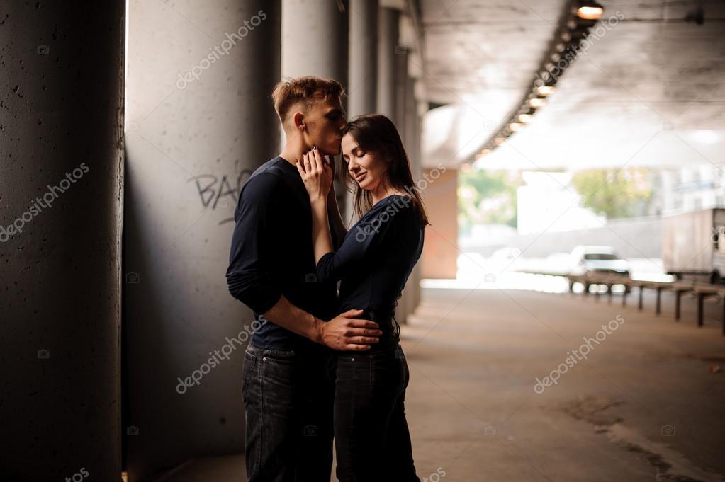 Side view of couple standing and hugging Stock Photo by ©Fesenko 121633644