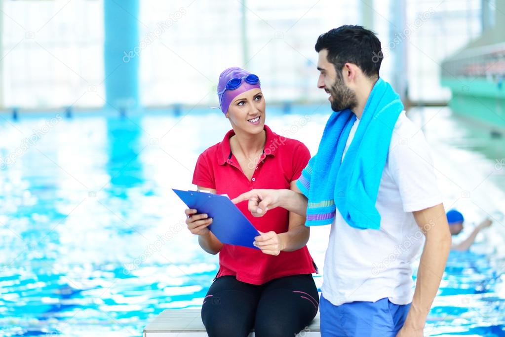 Swimmer and coach discussing — Stock Photo © blicsejo #116872652