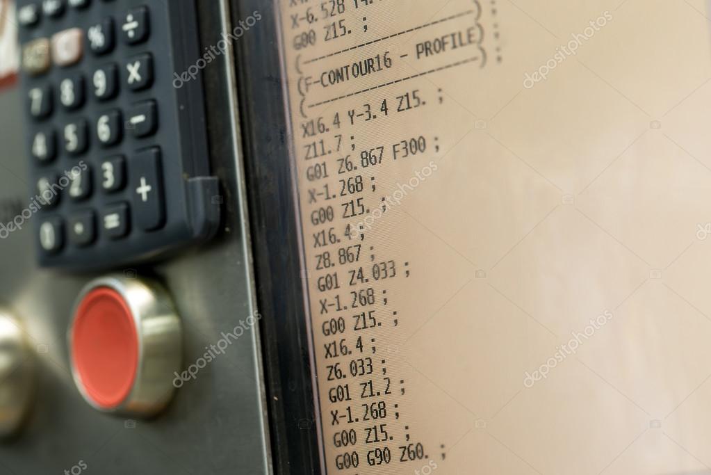 Display of programmable machine with big red button. Milling and lathe ...