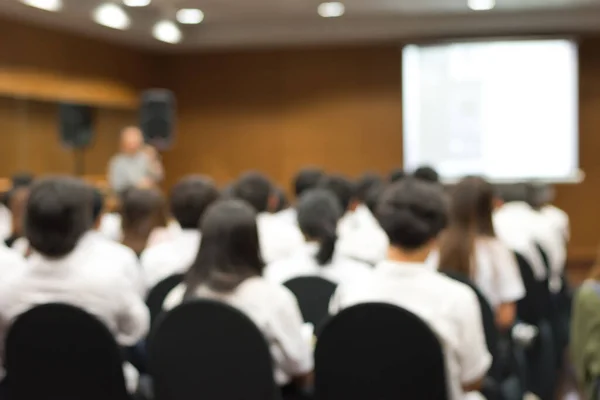 Blurred abstract background of university students sitting in a lecture ...