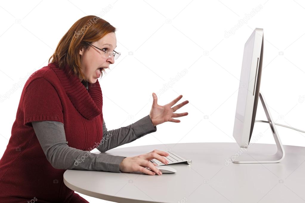Angry lady yelling on computer screen — Stock Photo © AlexBrylov #103686862
