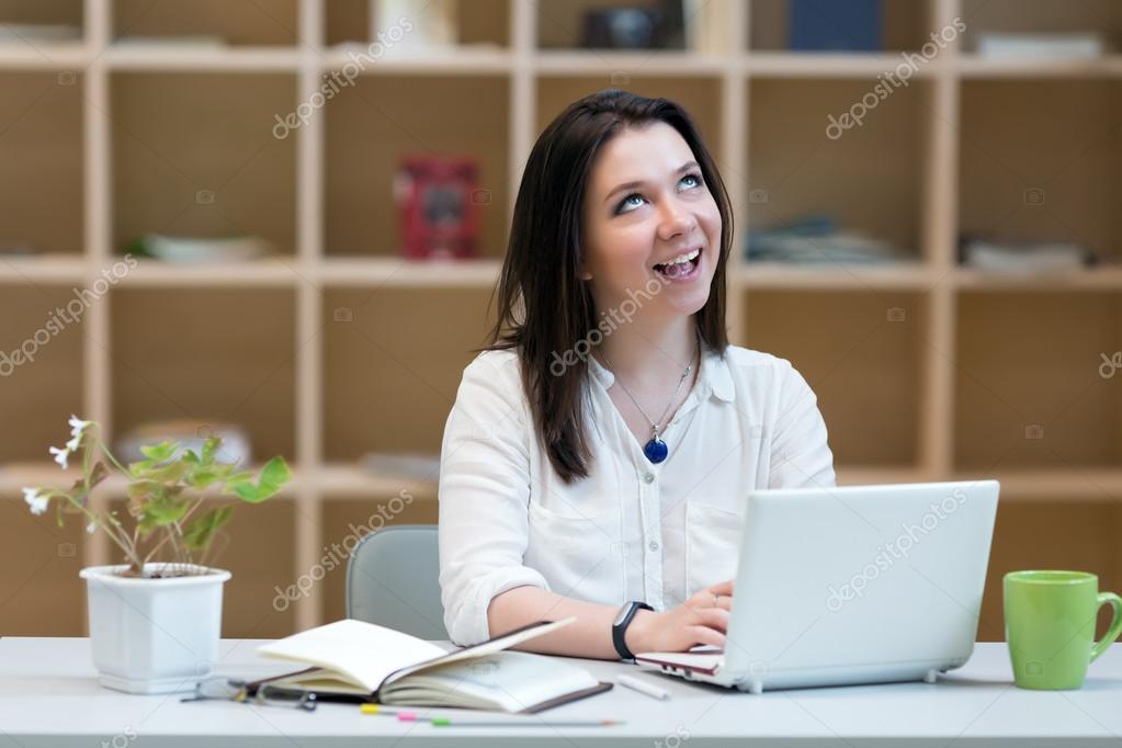 Young Woman discovered good Idea at working Place Stock Photo by ...