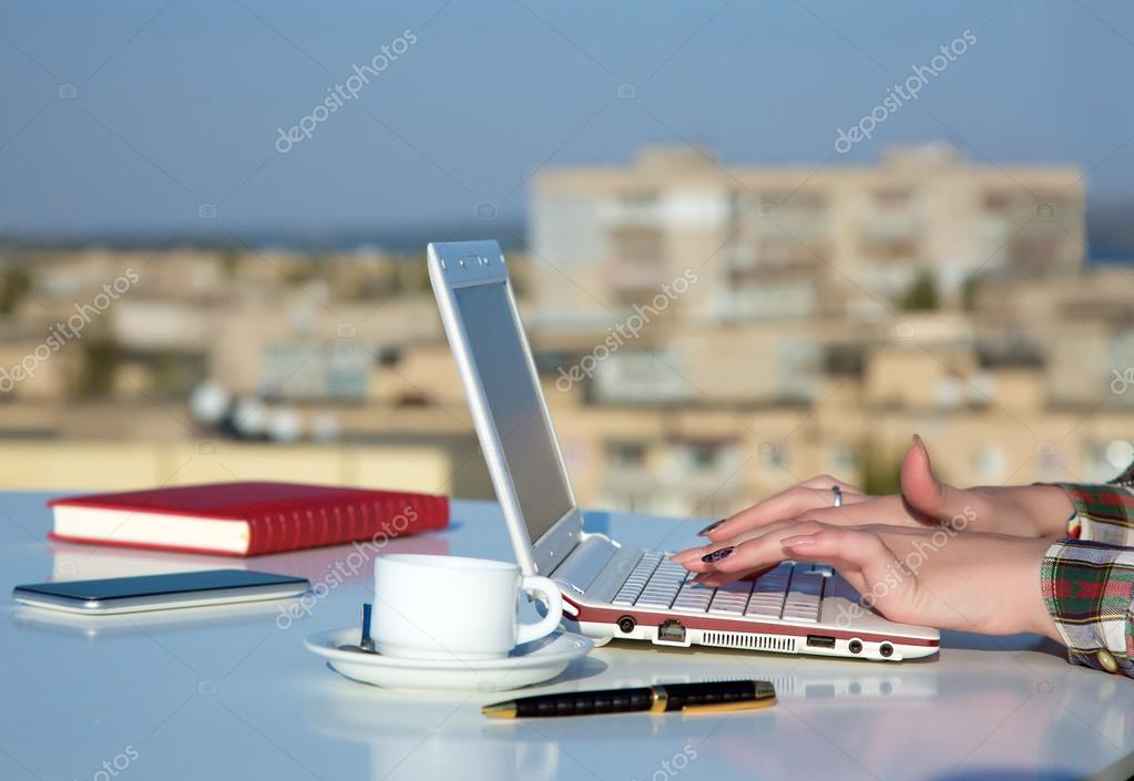Female Hands Typing on White Laptop Keyboard at Roof Top Cafe Terrace ...