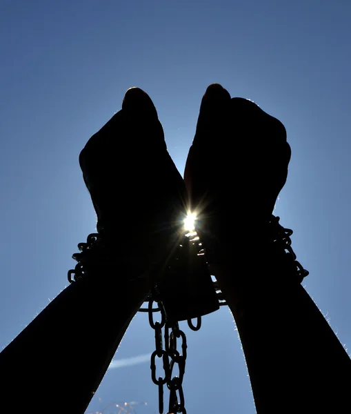 Hands in chains — Stock Photo © mikelo001 #63413219