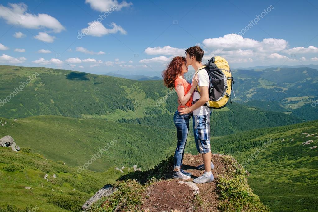 Happy couple enjoy beautiful view in the mountains — Stock Photo © Gilitukha #79872098