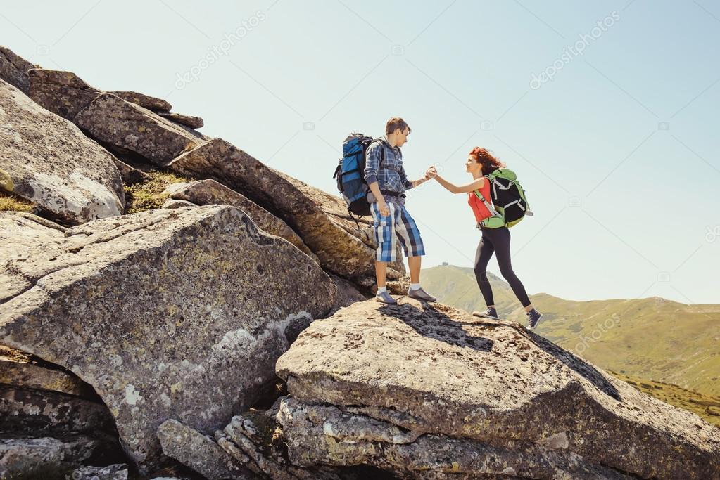 Young couple climbing in the mountains Stock Photo by ©Gilitukha 79872220