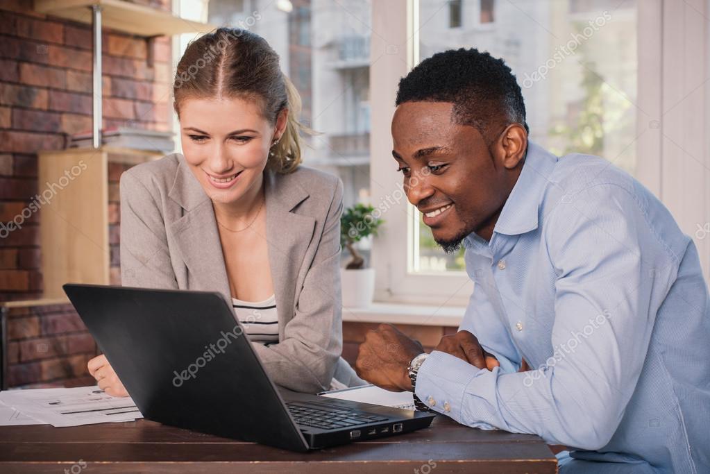 Two business people working together — Stock Photo © Gilitukha #85451742 Two business people working together — Stock Photo © Gilitukha #85451742