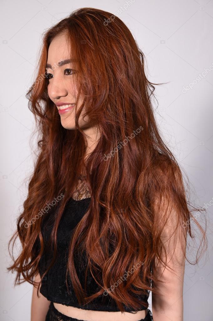 Beautiful model with long curly hair Stock Photo by ©nimon_t 60571367