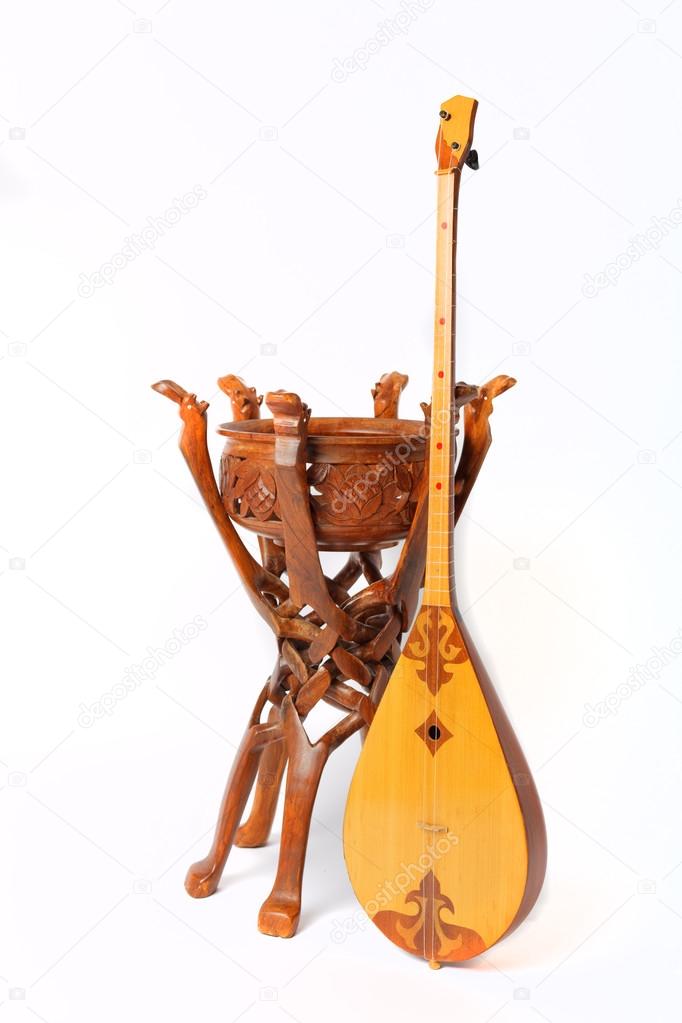 Kazakh national instrument dombra and taikazan on white background ...