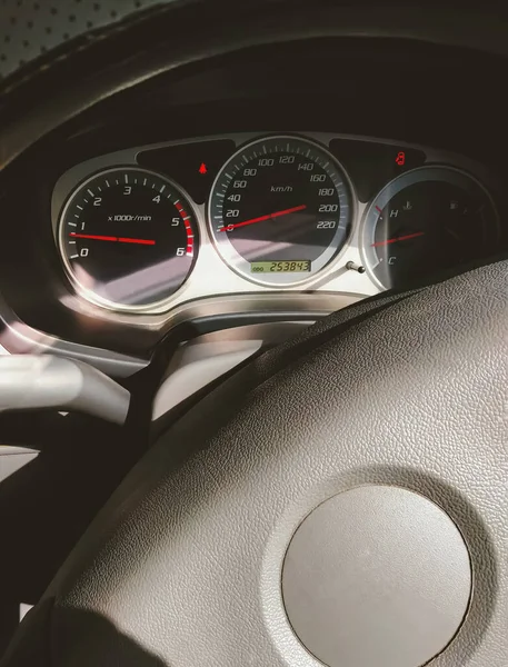 Sunlight and shadow on surface of steering wheel with car dashboard ...