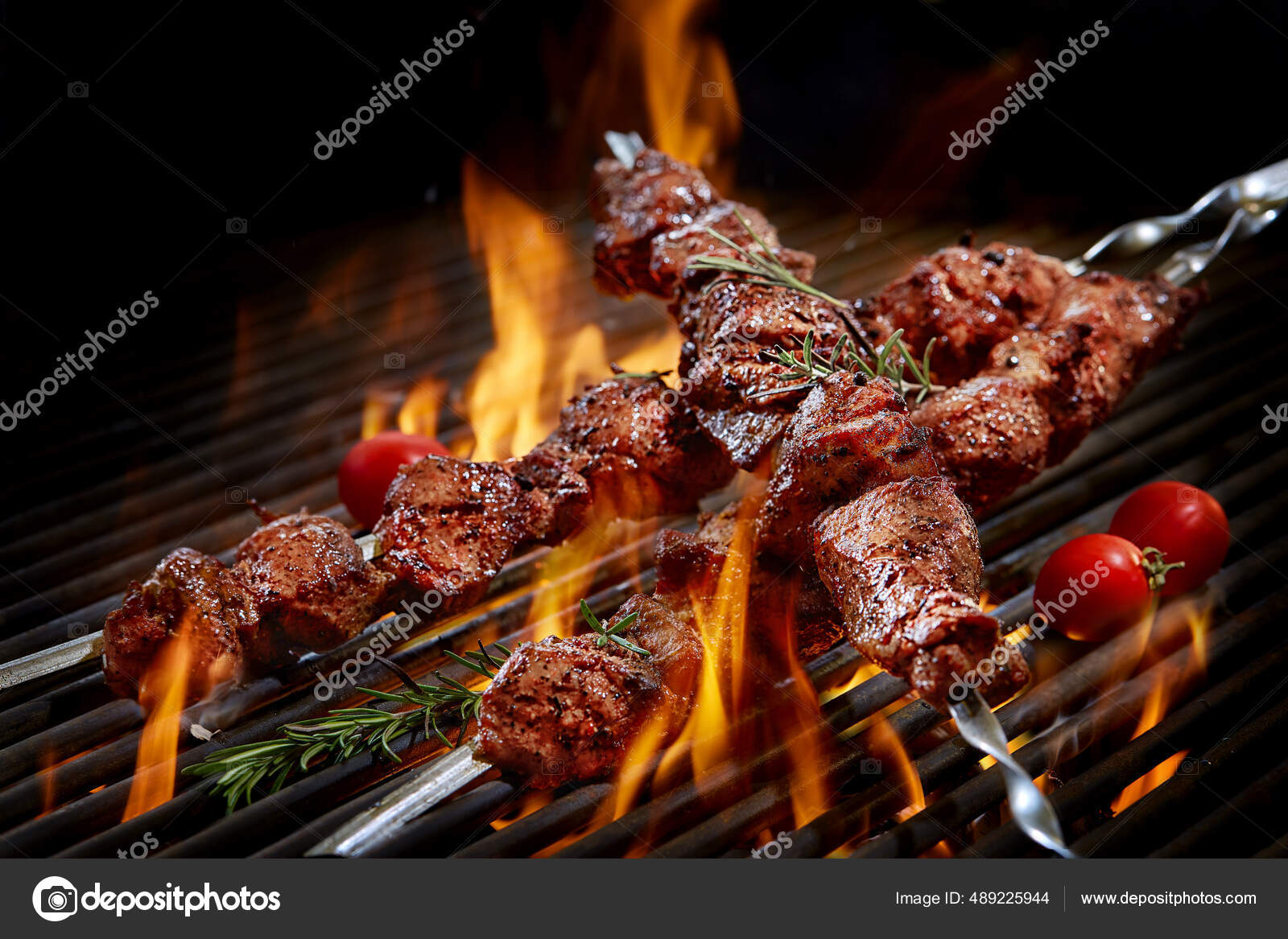Barbecue skewers meat kebabs with vegetables on flaming grill Stock ...