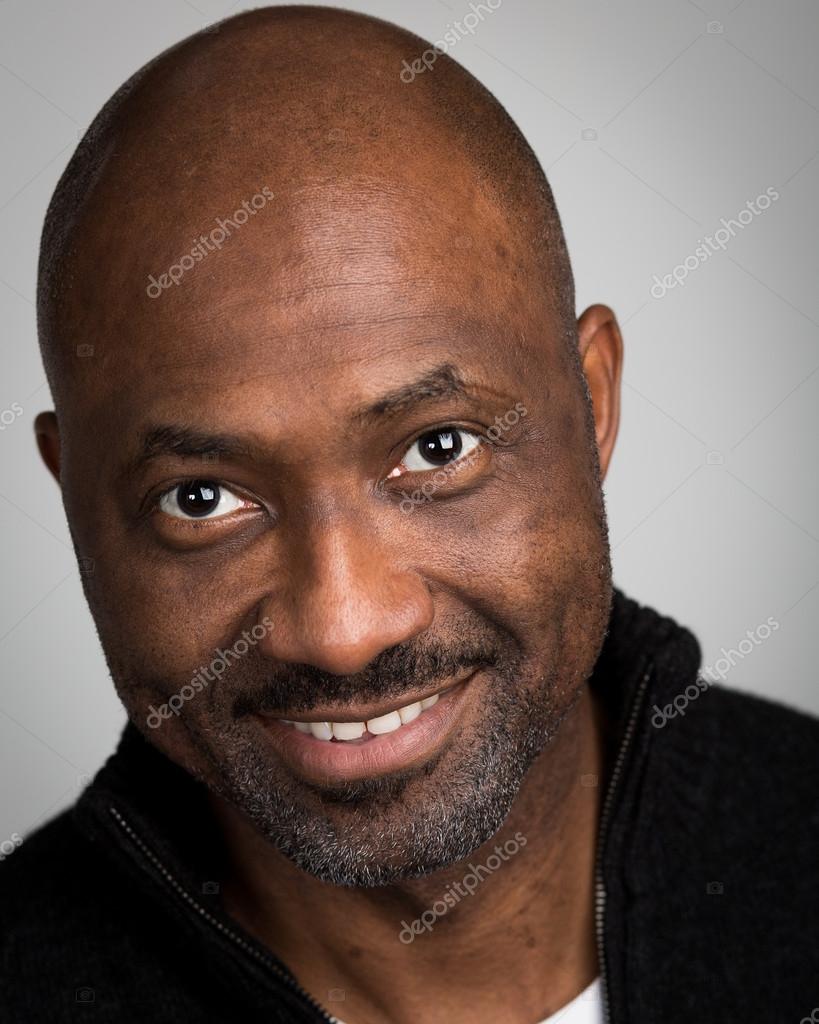 Bald Unshaven Black Man In His Forties Stock Photo by ©Heijo 61622543