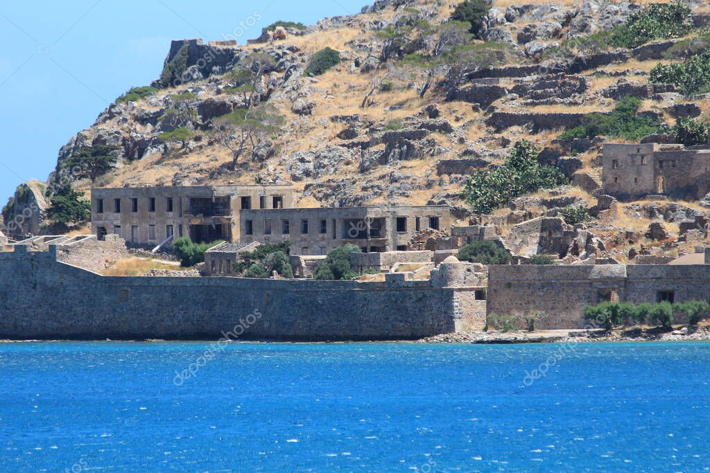 Abandoned old fortress and former leper colony, island Spinalonga ...