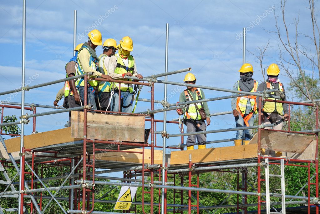 Construction workers working at high level – Stock Editorial Photo ...