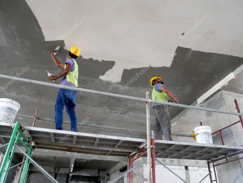 KUALA LUMPUR, MALAYSIA -APRIL 16, 2020: Construction site workers are ...