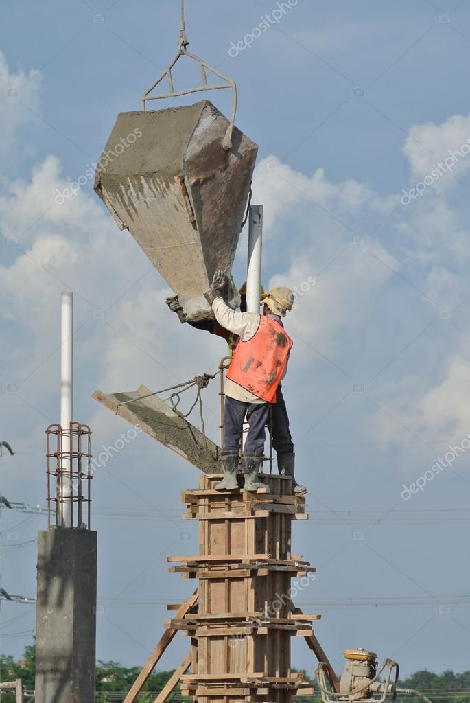 Construction workers casting column Stock Photo by ©Aisyaqilumar 61454859