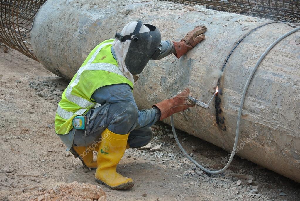 Welders welded bore pile metal casing — Stock Photo © Aisyaqilumar ...