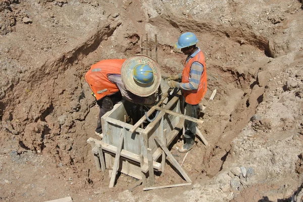 Construction workers installing pile cap formwork - Stock Image ...