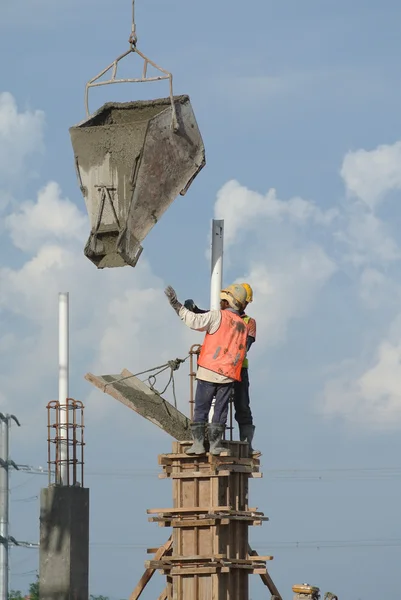 Group of construction workers casting beam ⬇ Stock Photo, Image by ...