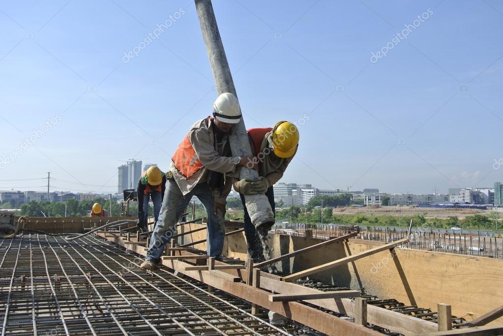 Construction Workers Using Concrete Hose from Concrete Pump – Stock ...