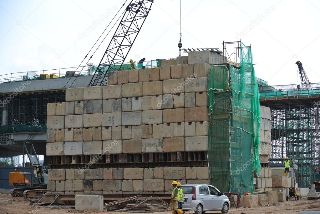 Construction workers stacking the maintain load test block at the ...
