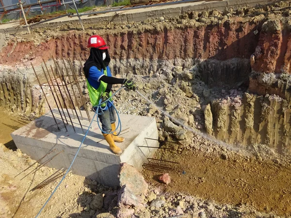 Construction workers spraying the anti termite chemical treatment ...