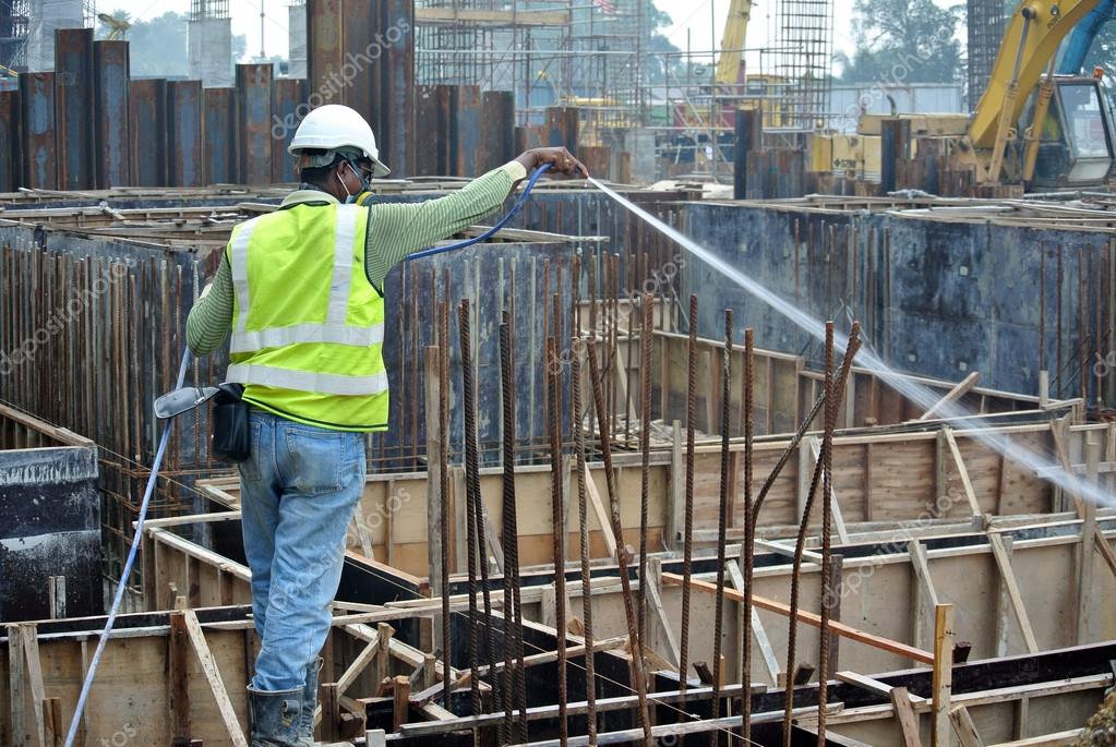 Construction workers spraying the anti termite chemical treatment ...