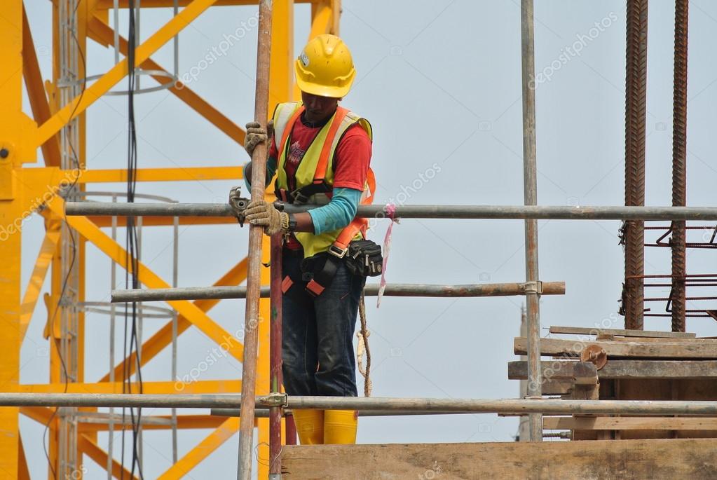 Construction workers working at high level – Stock Editorial Photo ...