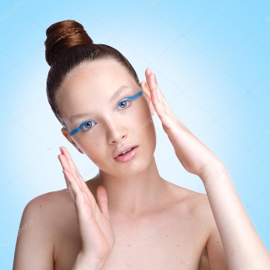 Beauty female model blue background. Futuristic fashion make up. Stock ...