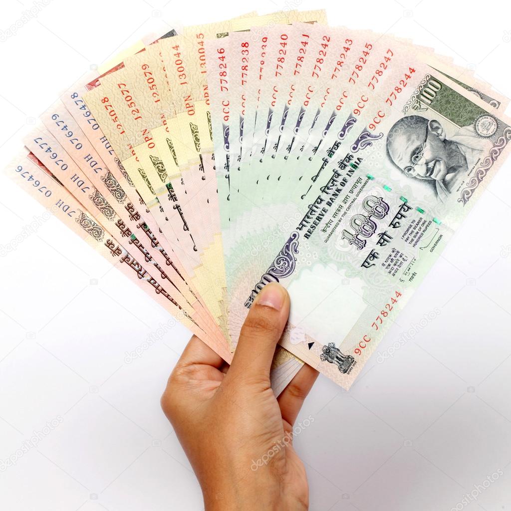Hand holding Indian rupee notes Stock Photo by ©snowwhiteimages 79772574