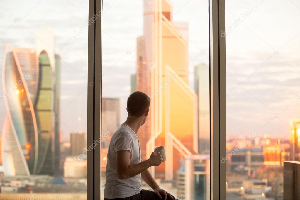 Man watching sunrise | Man watching sunrise in window — Stock Photo ...