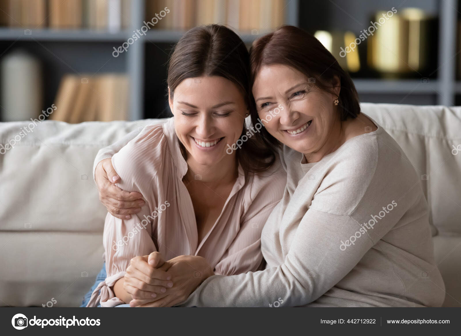 Close Up Smiling Mature Mother Embracing Grownup Daughter Having Fun