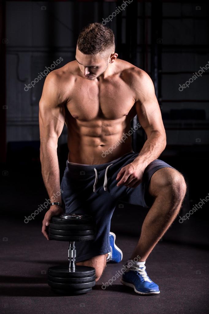 Cool young bodybuilder in gym — Stock Photo © fizkes #81953768