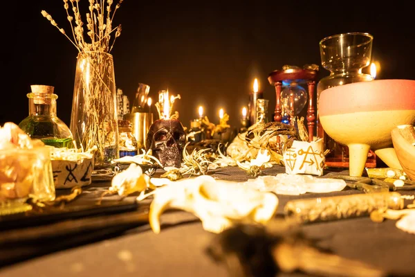 Witchcraft still life with burning candles selective focus on skull ...