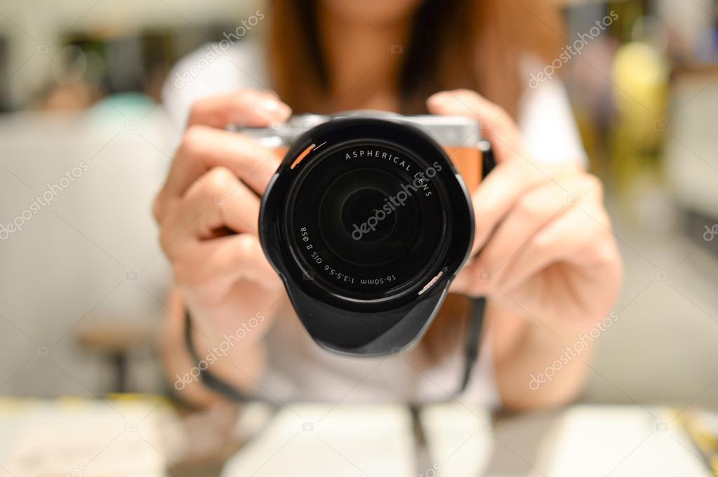 Girl and camera — Stock Photo © aon168 #77385188