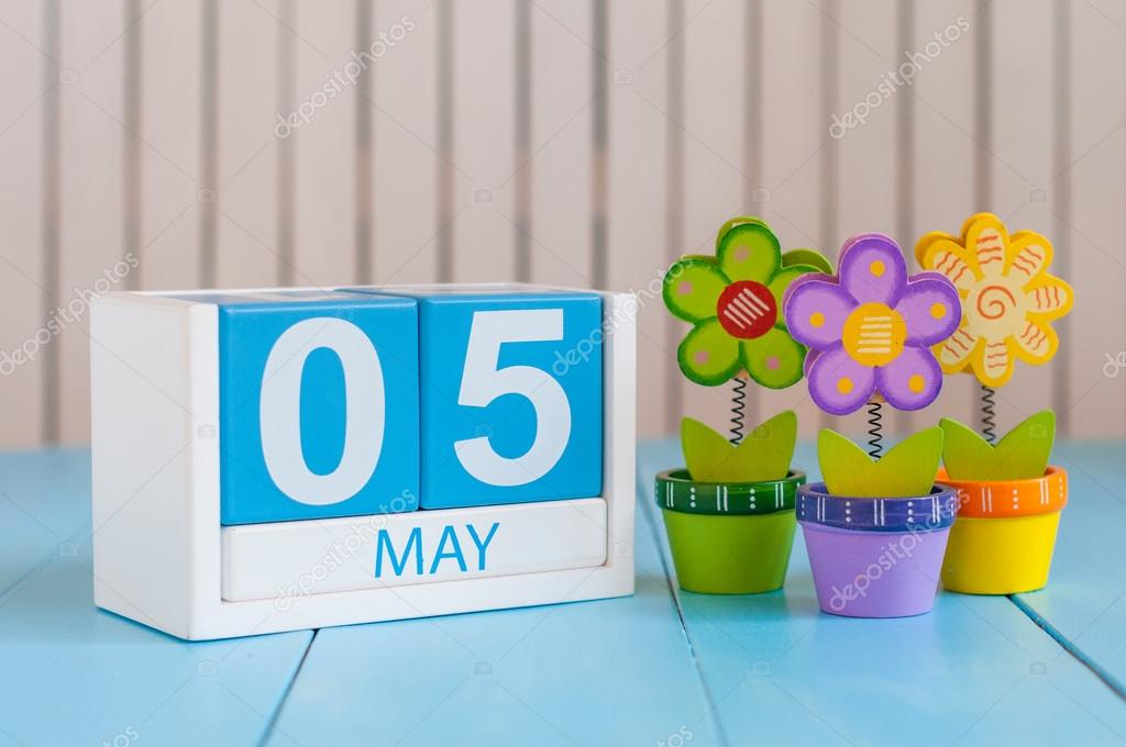 May 5th. Image of may 5 wooden color calendar on white background with ...