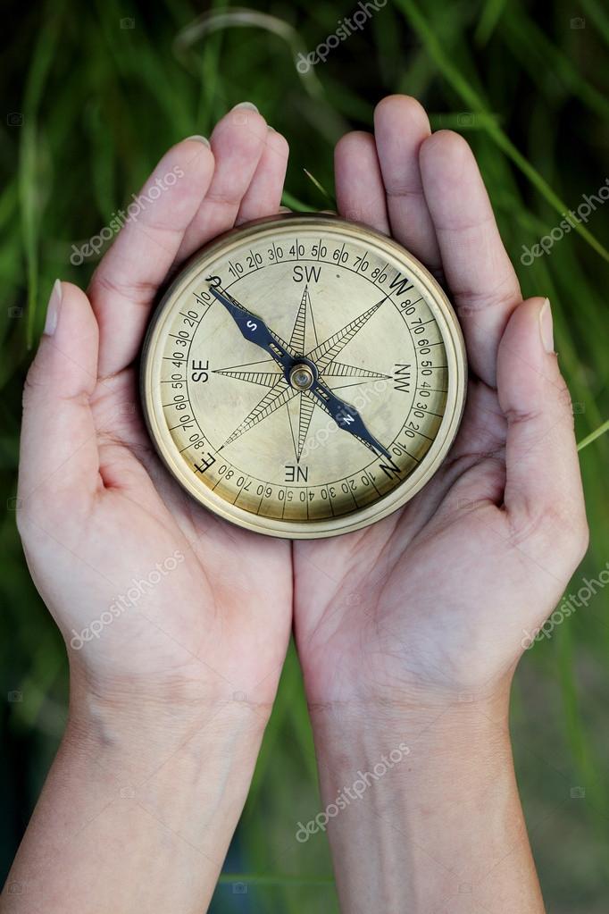 Hands holding old style antique compass Stock Photo by ©Qpicimages 60755893